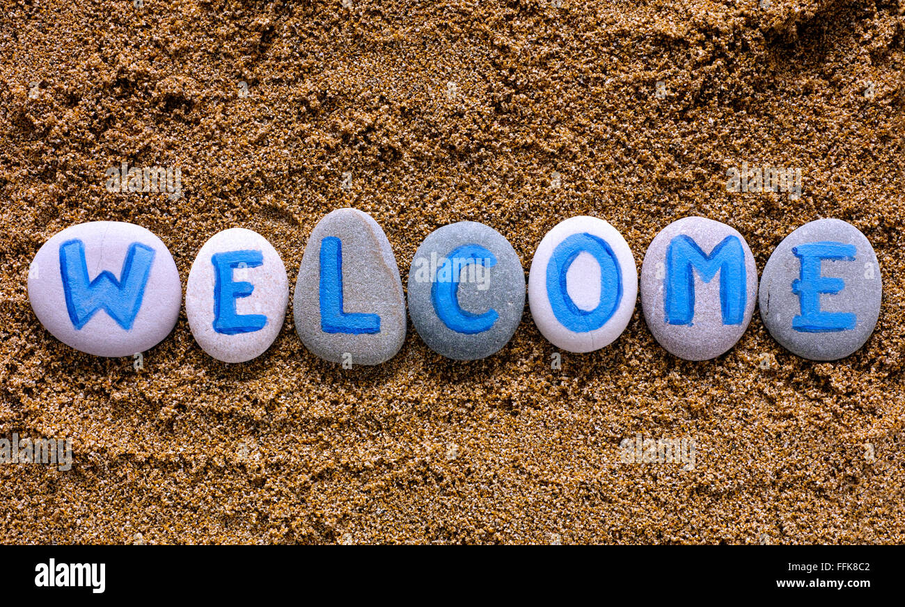 Word Welcome spell out from stones with letters on sea sand. Letters ...