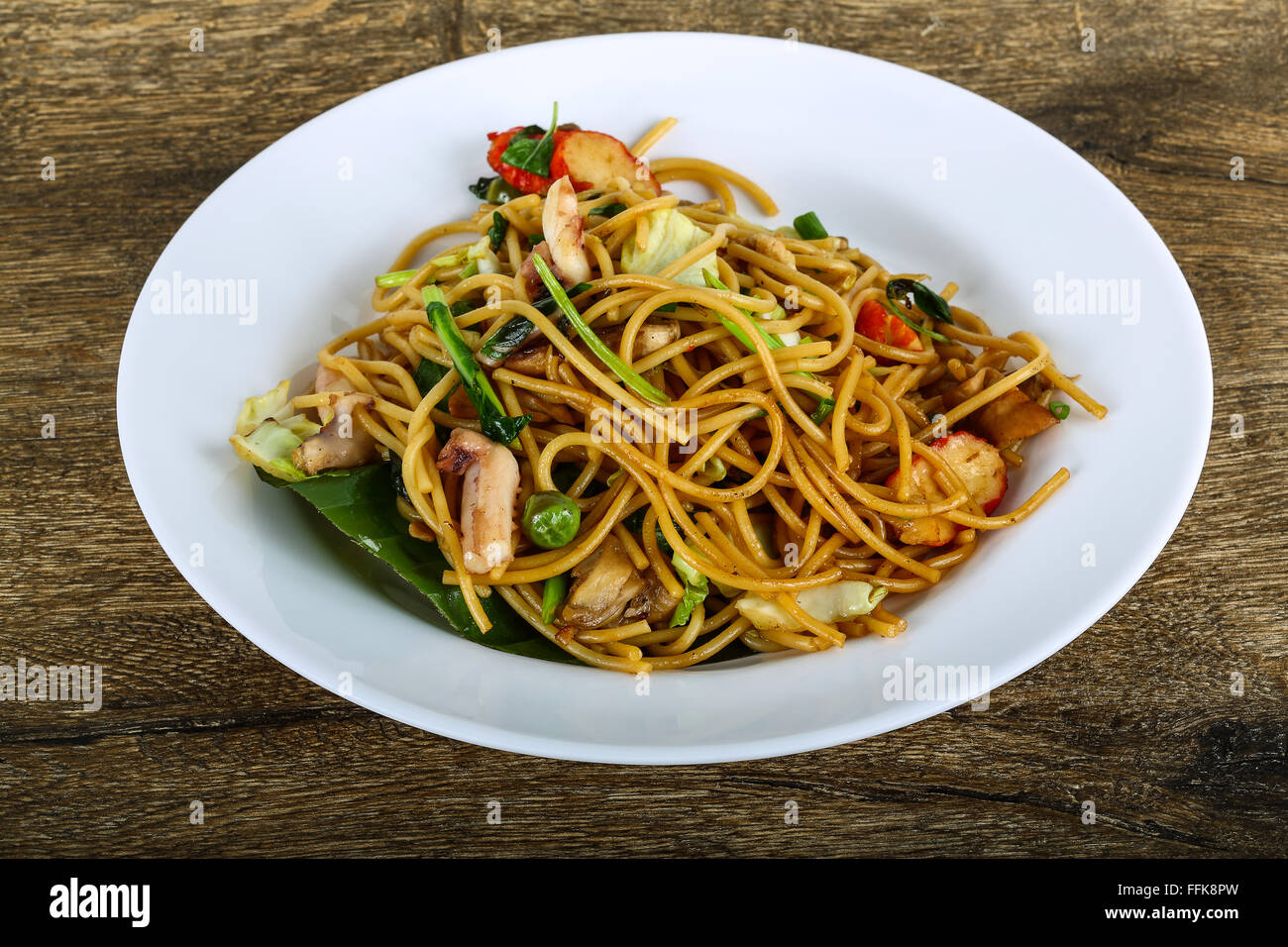 Asian style pasta with seafood on banana leaf Stock Photo - Alamy