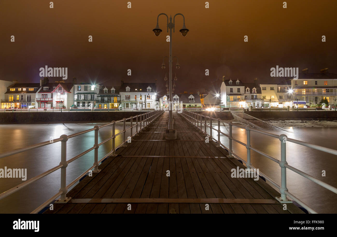 View across a Victorian wooden bridge towards the shore. This is the ...
