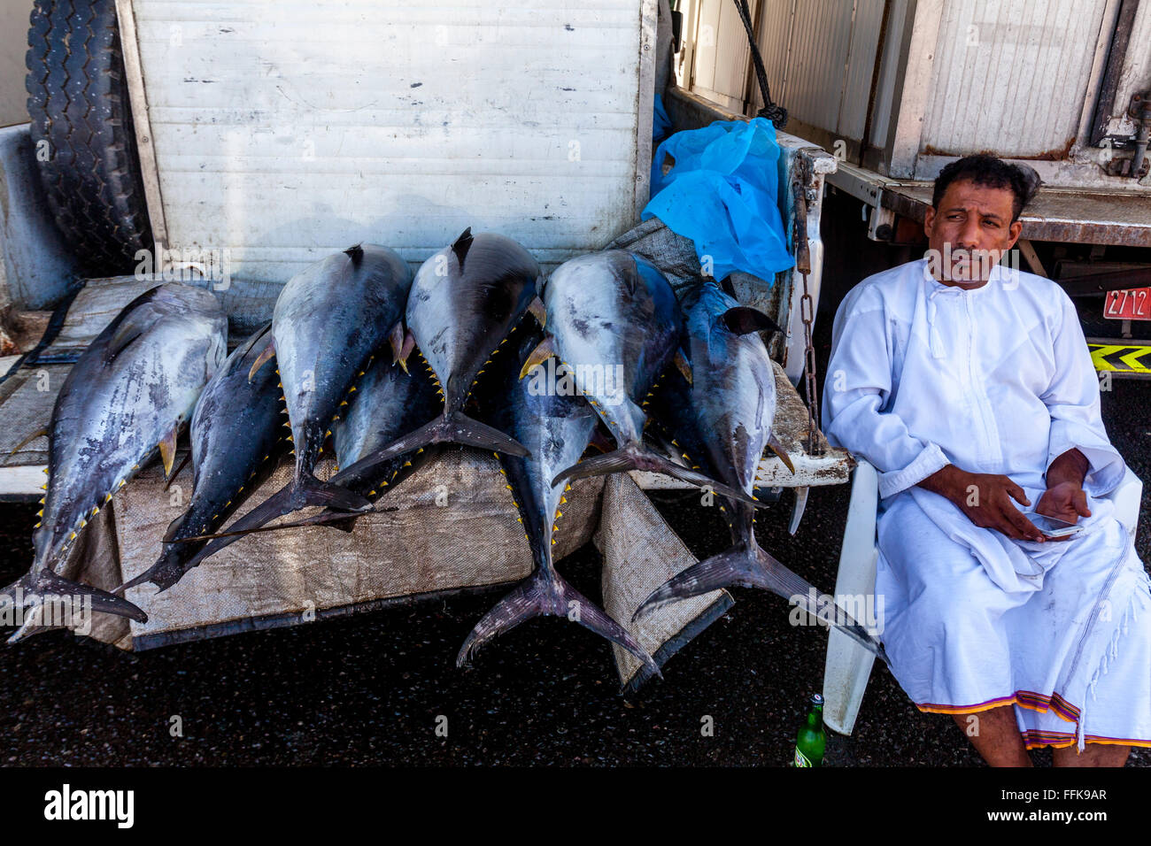 An Omani Man Sells Fish At The Fish Market, Muttrah, Muscat, Sultanate ...