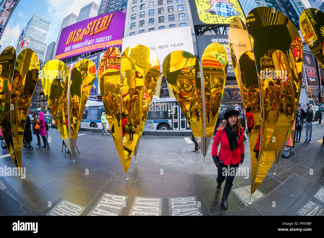 Visitors view their reflections in "Heart of Hearts", the winner of the ...