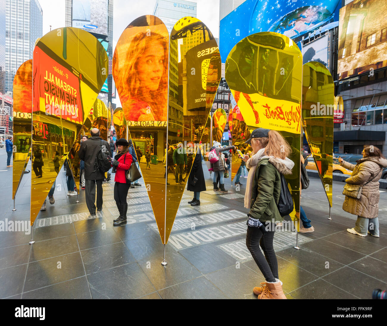 Visitors view their reflections in "Heart of Hearts", the winner of the ...