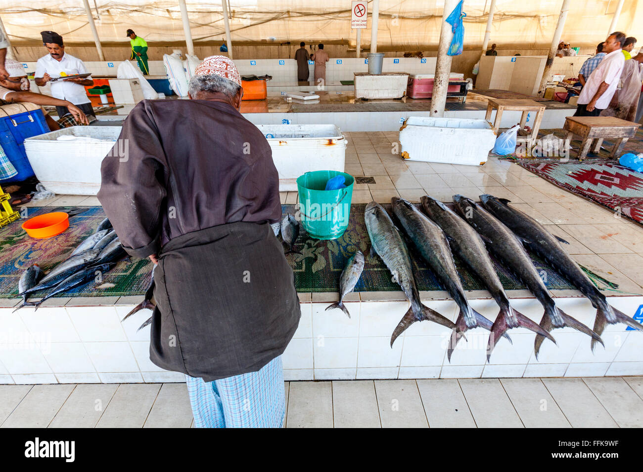 A Elderly Man Buying Fresh Fish At The Fish Market, Muttrah, Muscat ...