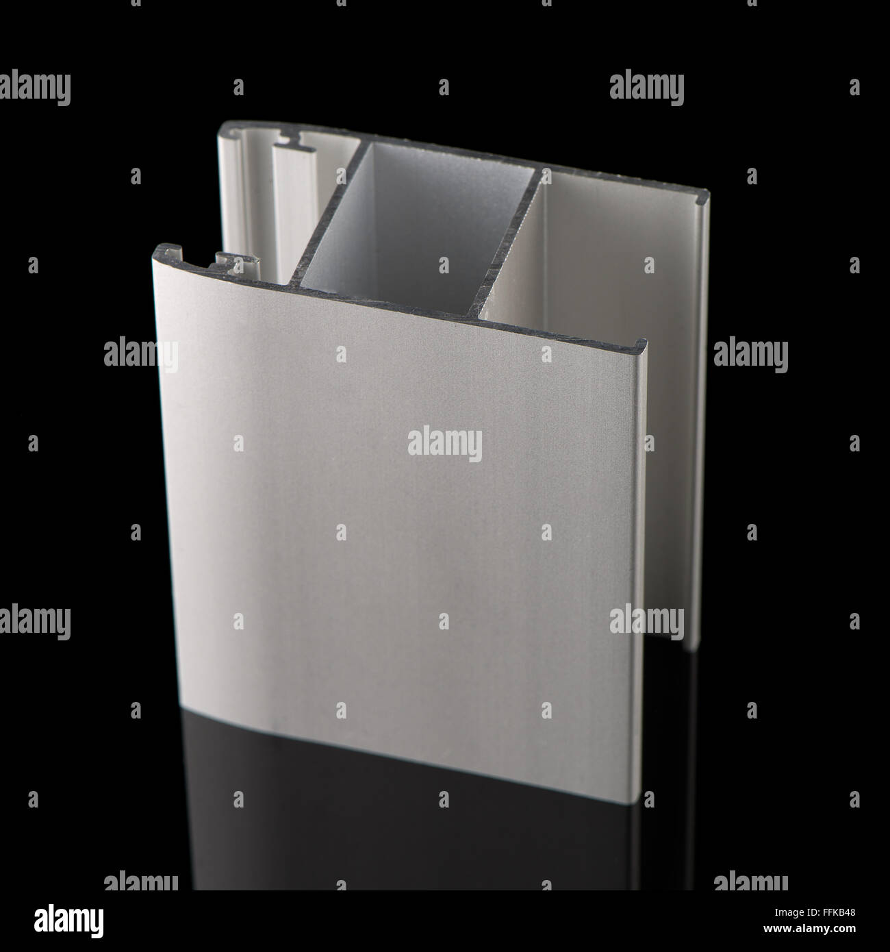 Aluminium profile sample isolated on black background Stock Photo - Alamy