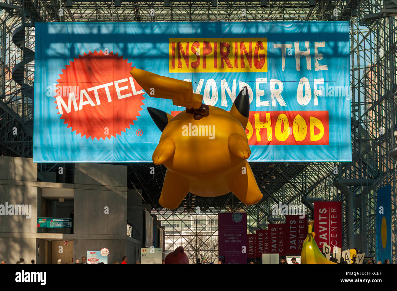 The rear end of a Pokemon balloon in front of a Mattel banner at the ...
