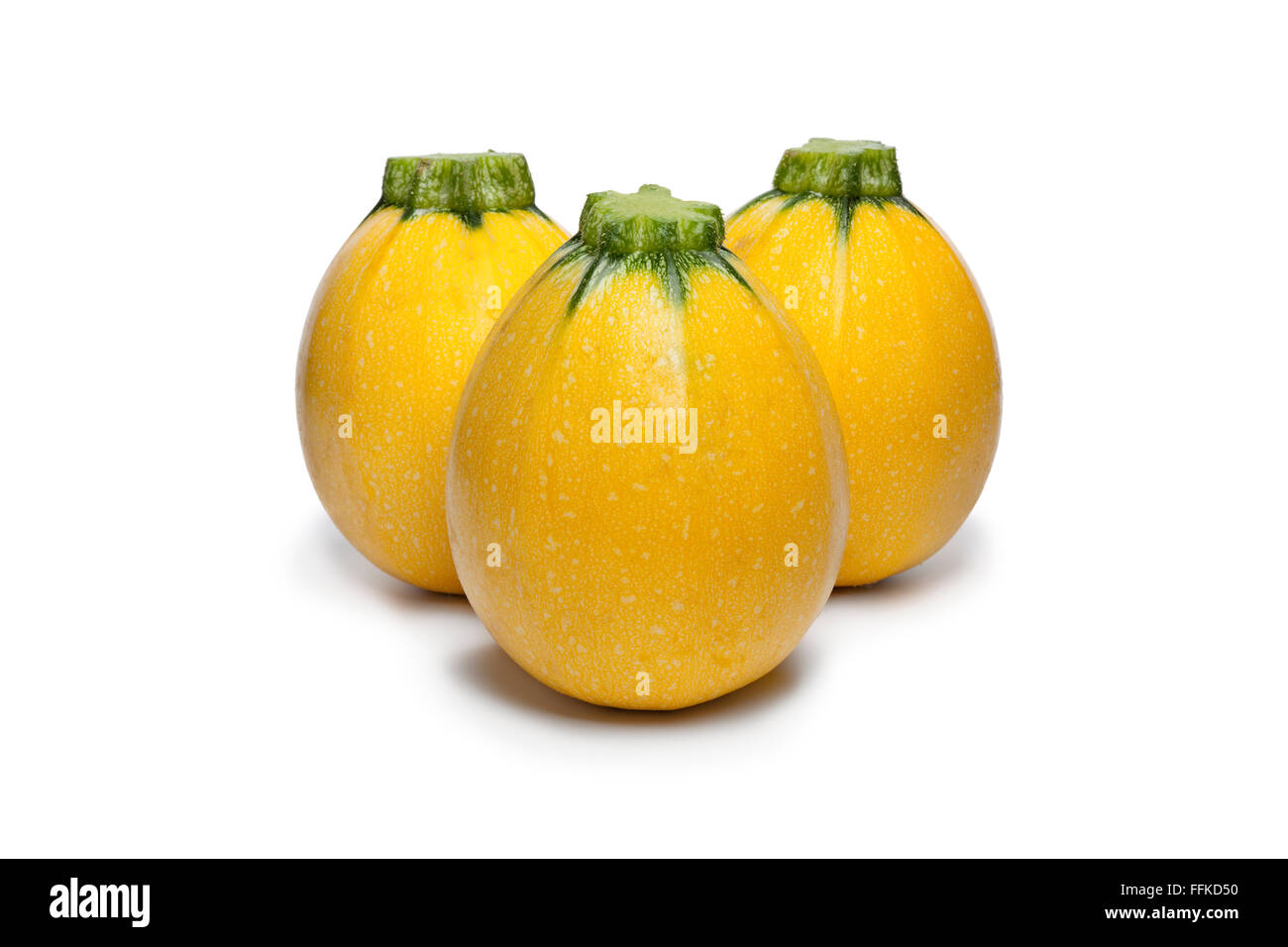 Fresh yellow round courgettes on white background Stock Photo - Alamy