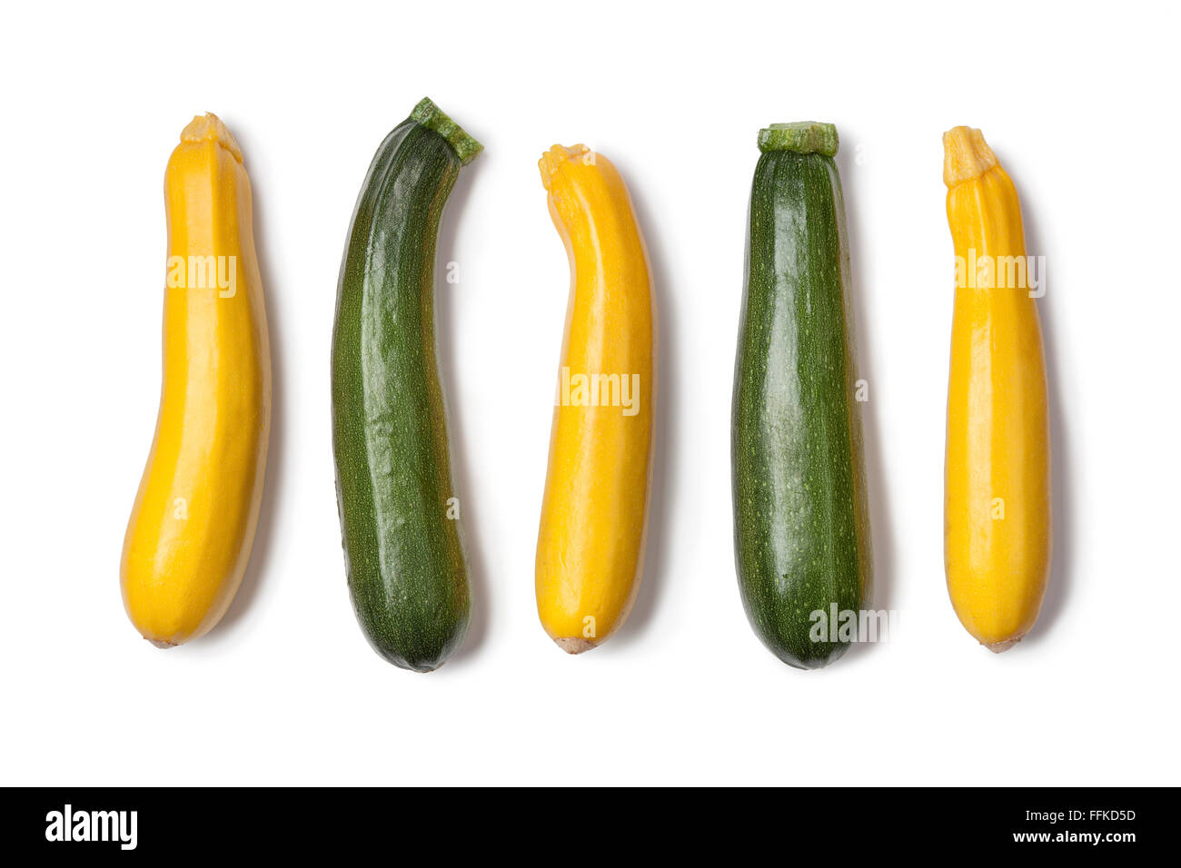 Fresh yellow and green courgettes on white background Stock Photo - Alamy
