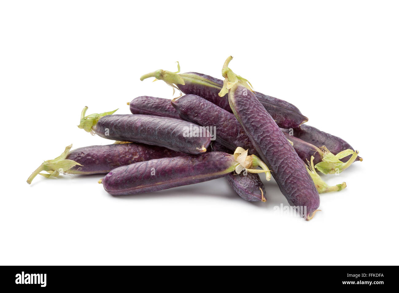 Fresh peas in purple pod on white background Stock Photo - Alamy