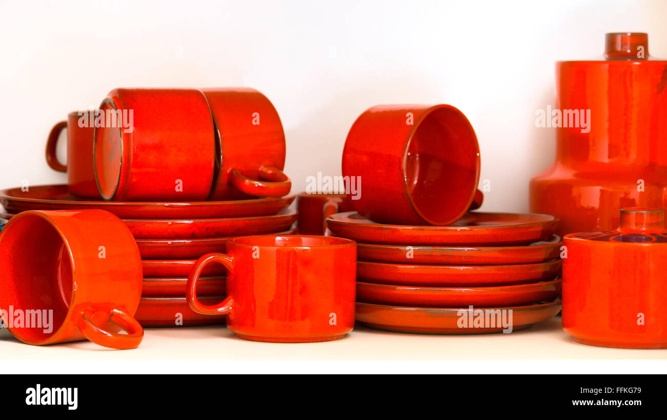 set of red ceramic cups isolated over white Stock Photo - Alamy