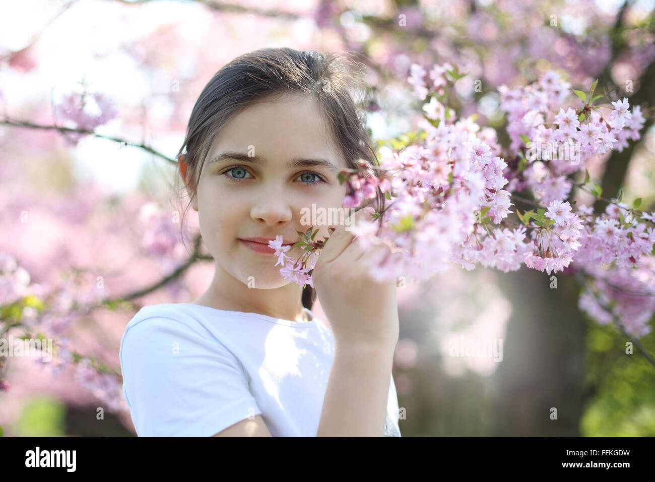 Girl smelling a flower hi-res stock photography and images - Alamy