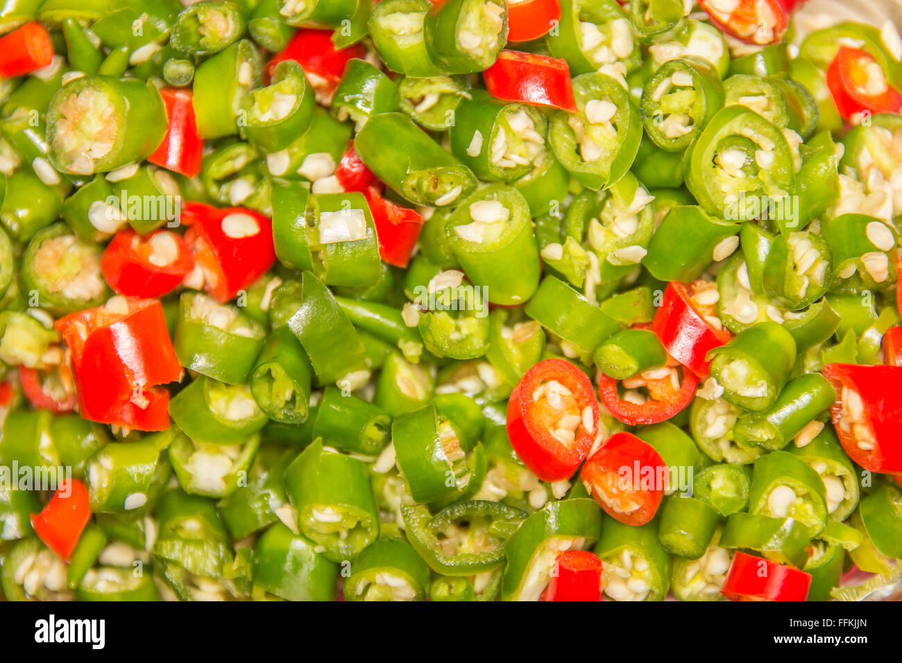 A pile of finely chopped chilli peppers on background Stock Photo - Alamy