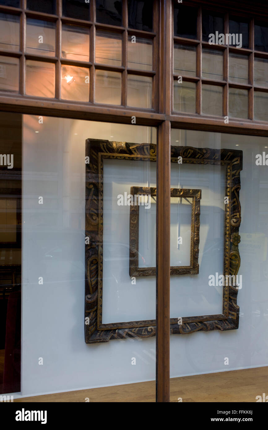 Square shaped picture frames in the window of an art gallery in St ...