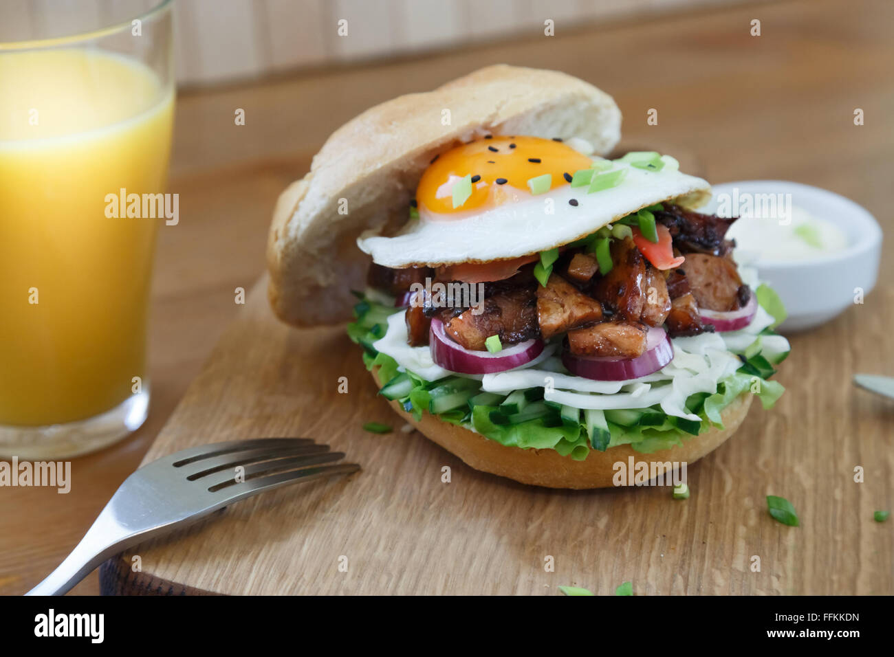 Japanese chicken burger with onions, letucce and egg Stock Photo - Alamy