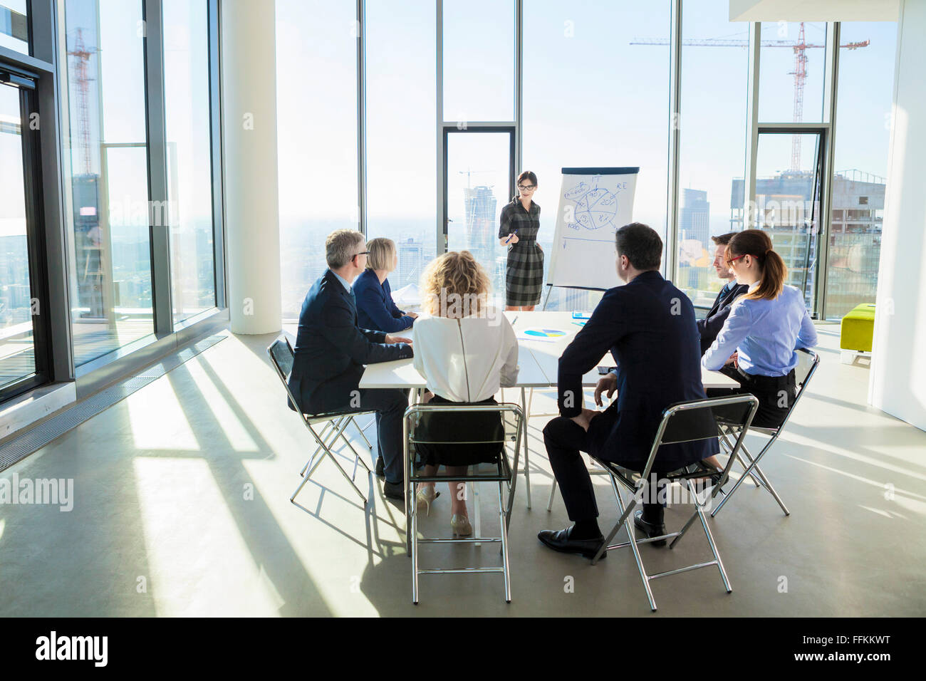 Female architect giving presentation in business meeting Stock Photo ...