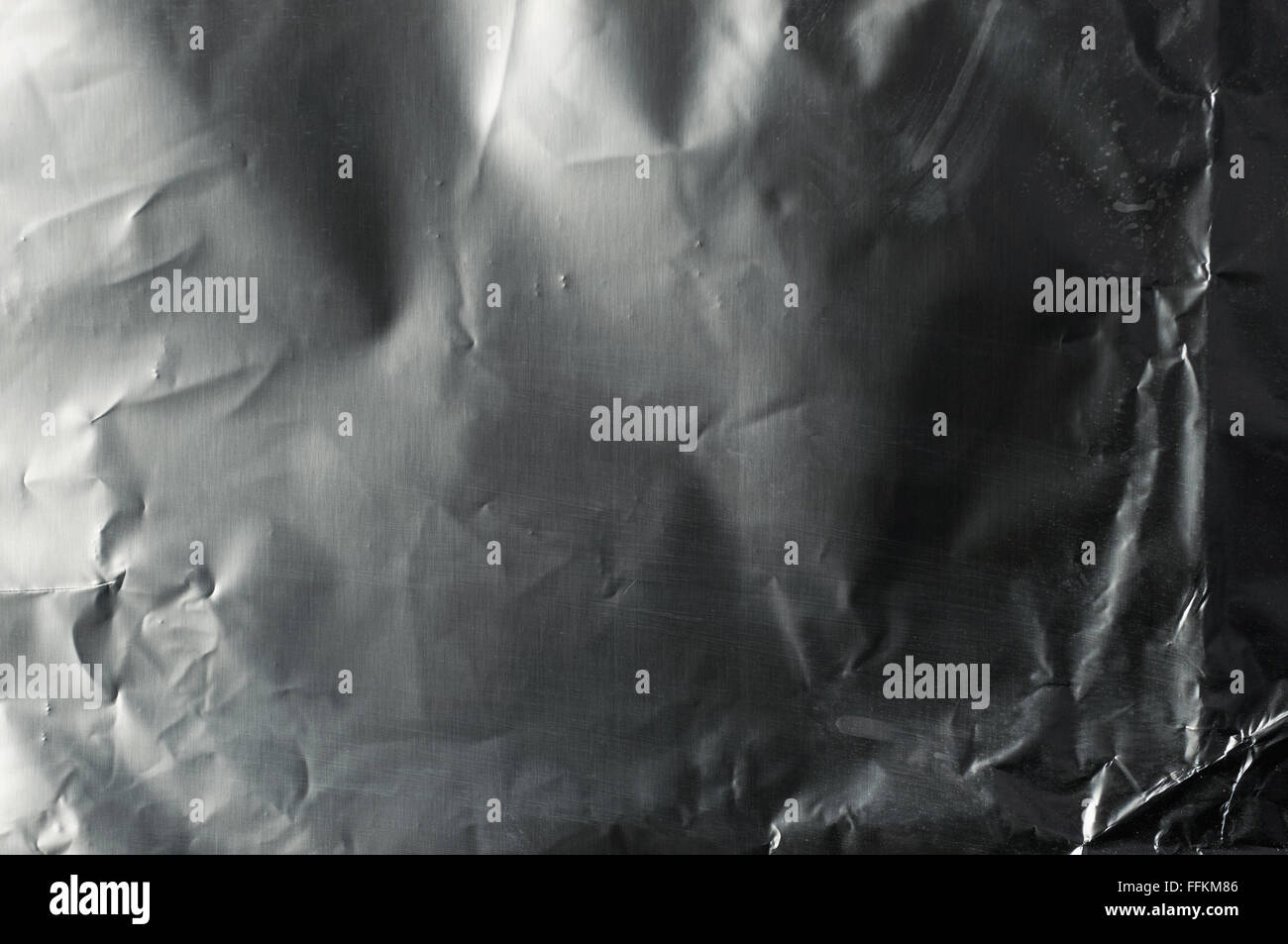 Crumpled silver sheet for abstract backgrounds Stock Photo - Alamy