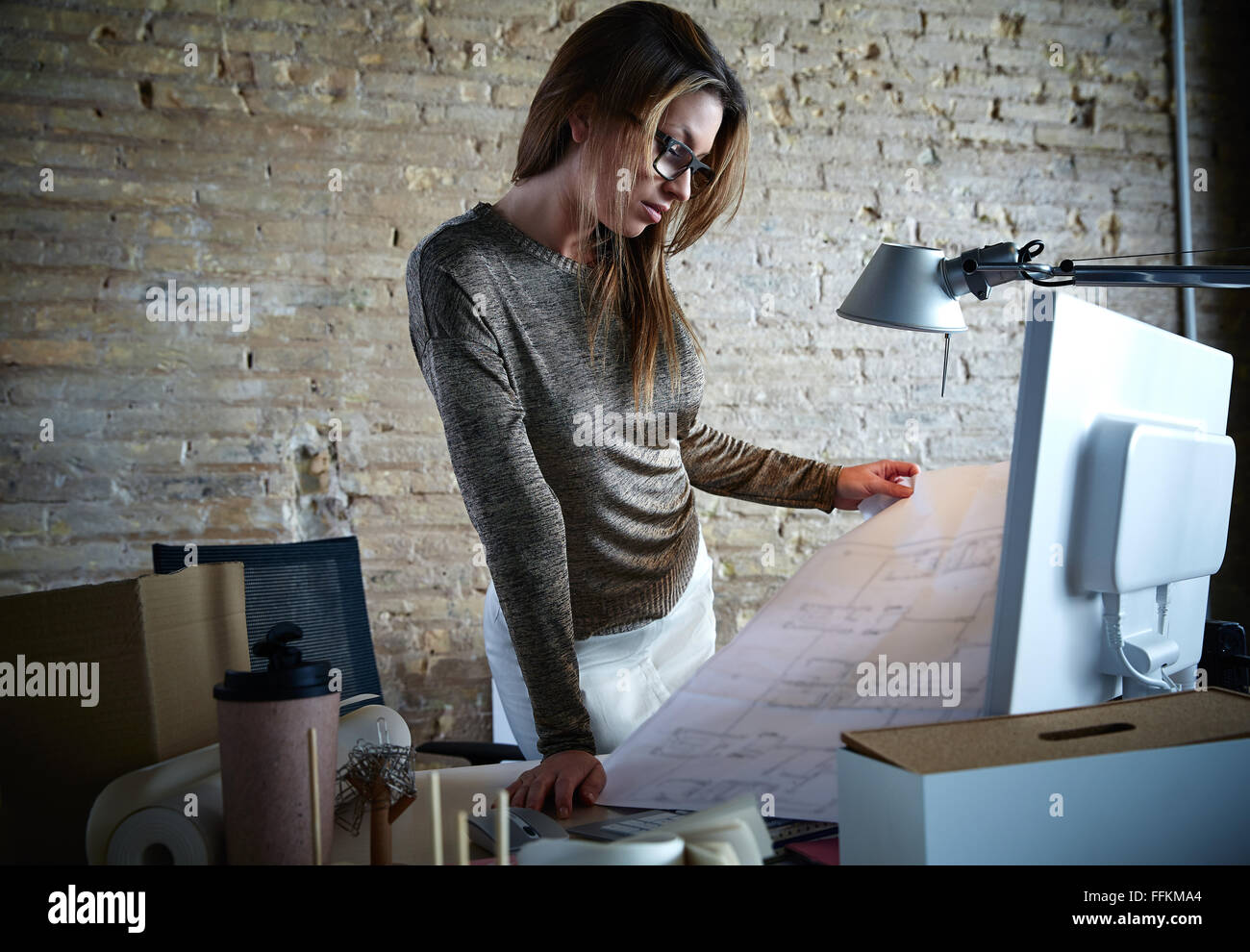 Architect engineer woman working with plan at office indoor Stock Photo ...