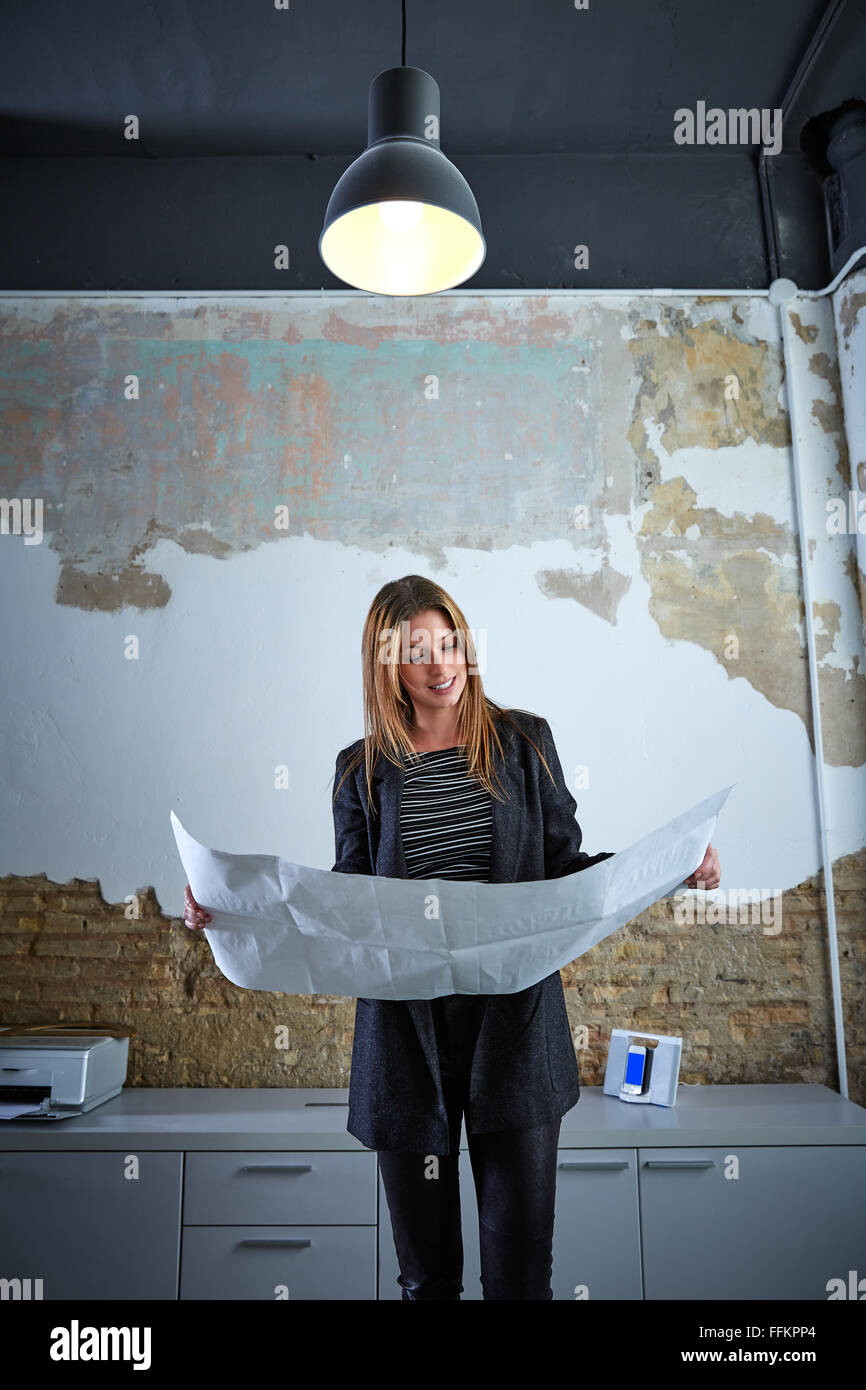 Architect woman working holding plan paper at office Stock Photo - Alamy