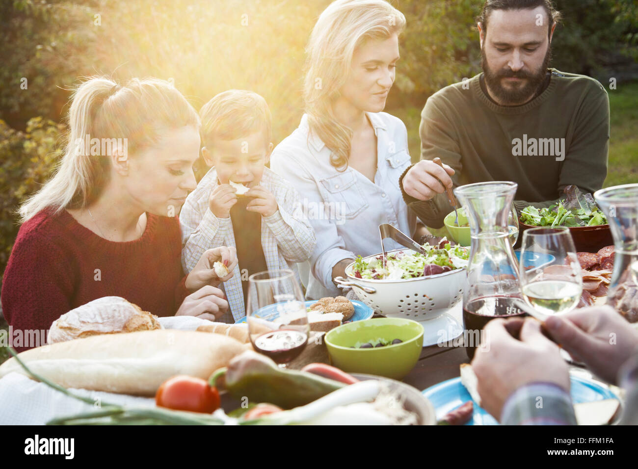 Group of friends celebrating together on garden party Stock Photo - Alamy