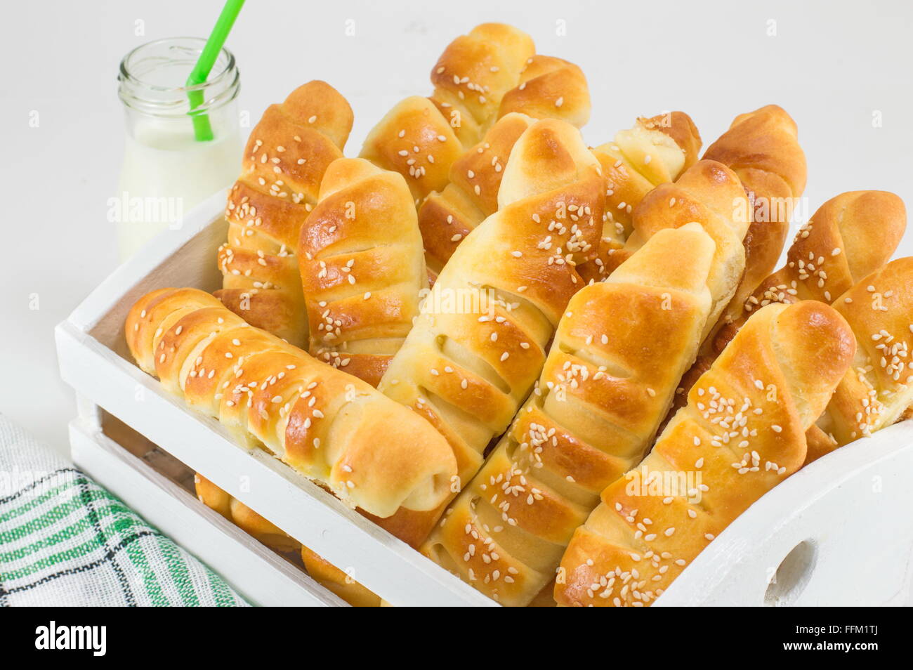 bunch of sesame pastry in a white crate Stock Photo - Alamy