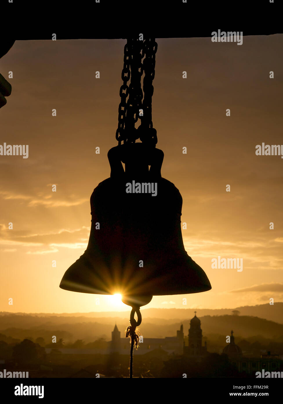 Bell in the Sunset Stock Photo - Alamy