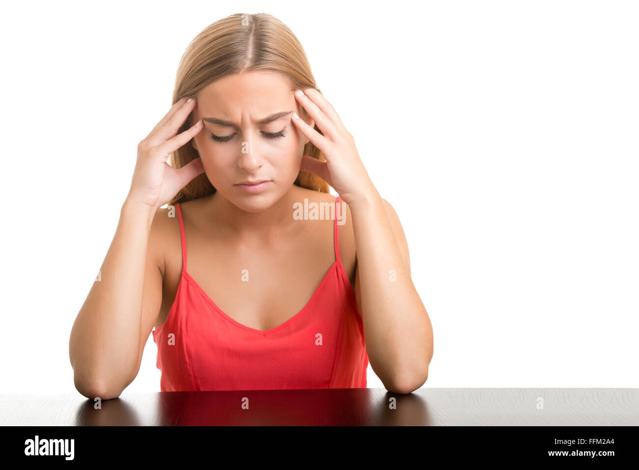 Woman suffering from an headache, holding her hand to the head ...