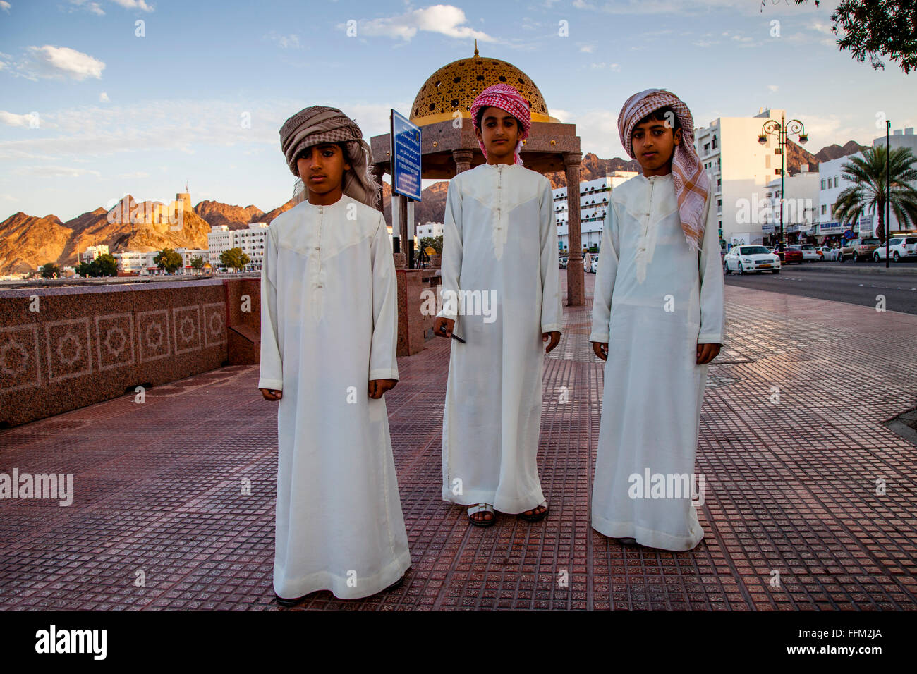 Omani Children Dressed In The Traditional Dishdasha and Mussar Headwear ...