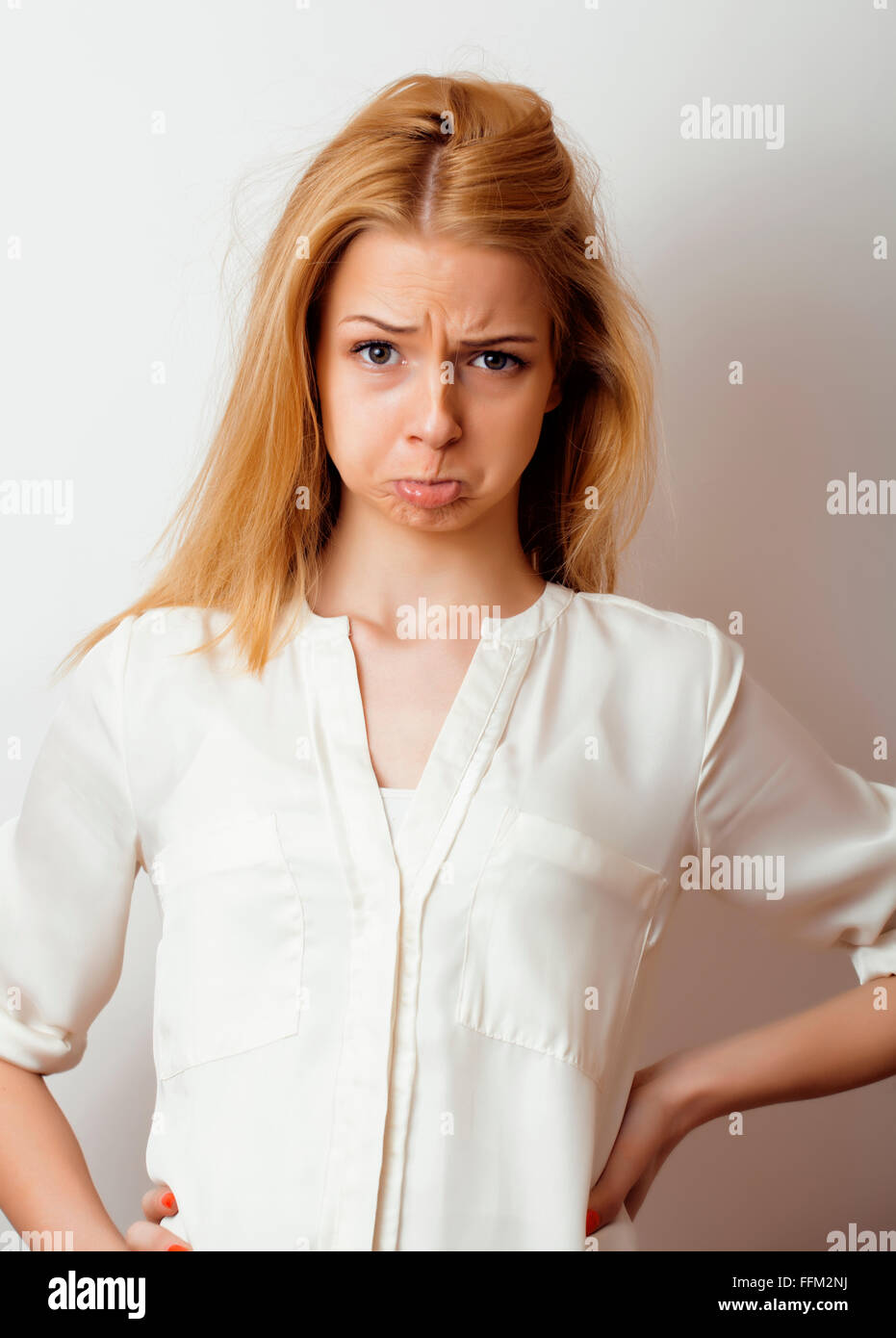 teenage cute blond girl thinking, frustrated, emotional on white ...