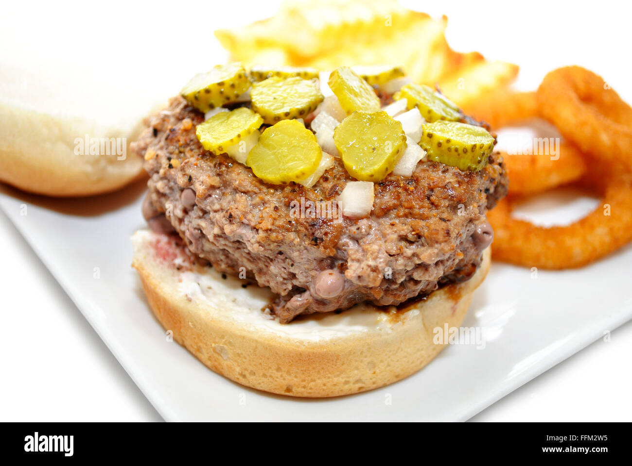 Rare Hamburger with Chopped Pickles and Onions Stock Photo - Alamy