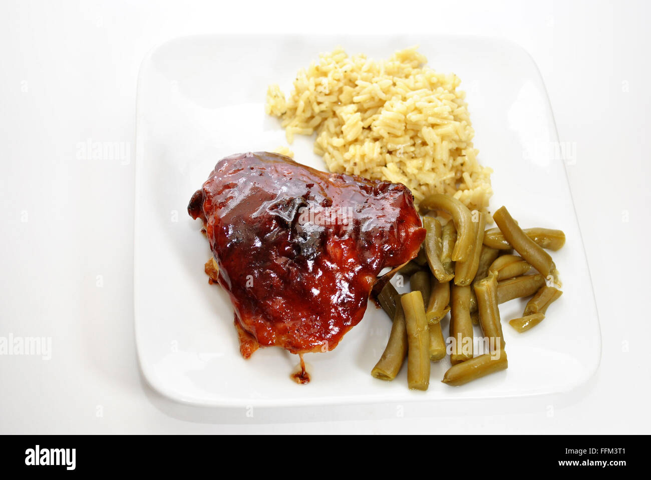 Barbecue Chicken and Rice Dinner with Green Beans Stock Photo - Alamy