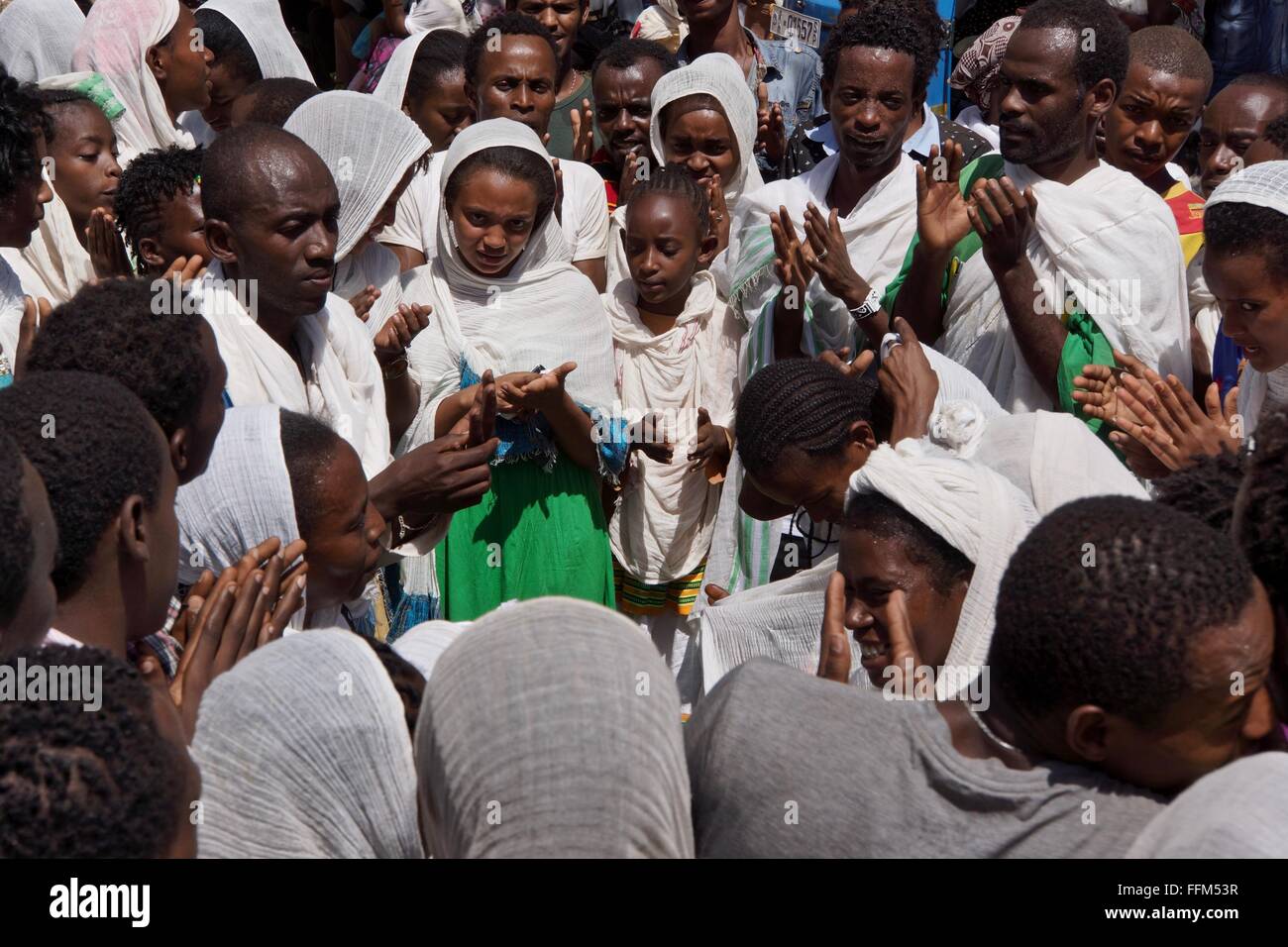 A group sing and pray Stock Photo - Alamy