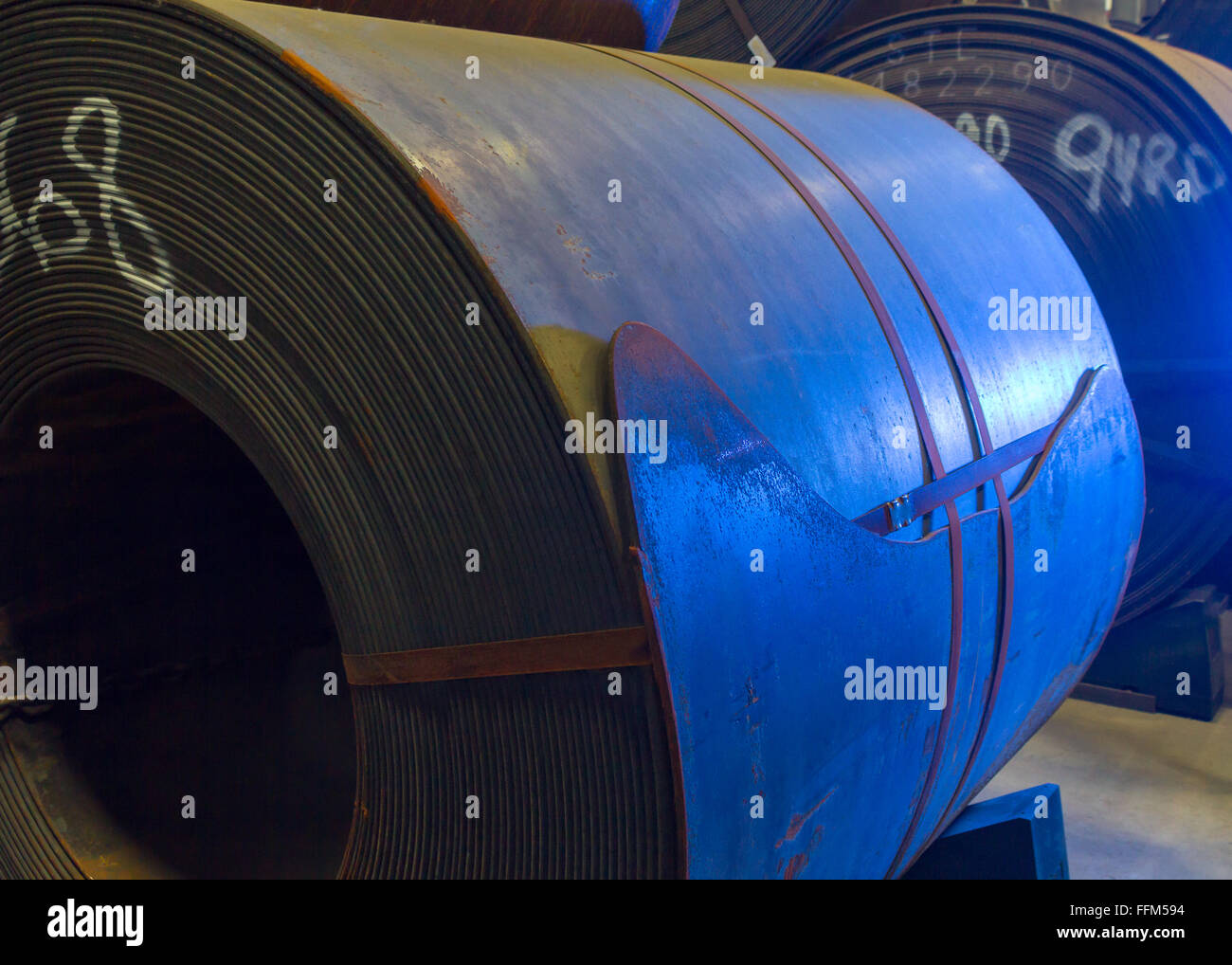 Coil with bands around the belly and sides lit with blue lighting ...