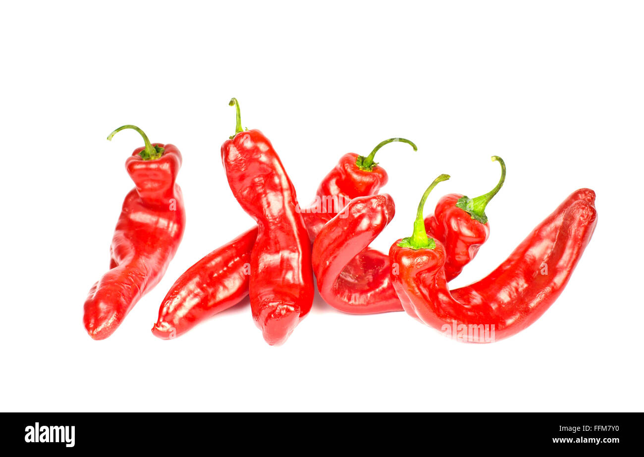 Five twisted fresh red peppers isolated on white background Stock Photo ...