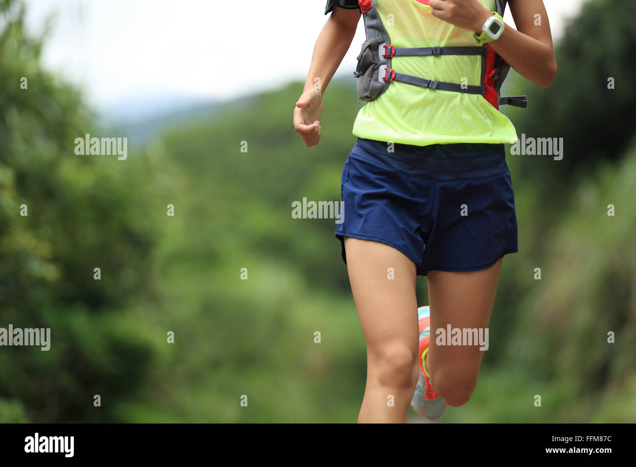 young fitness woman trail runner running on trail Stock Photo - Alamy
