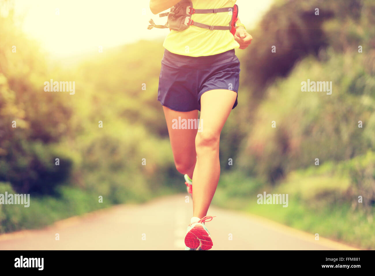 young fitness woman trail runner running on trail Stock Photo - Alamy