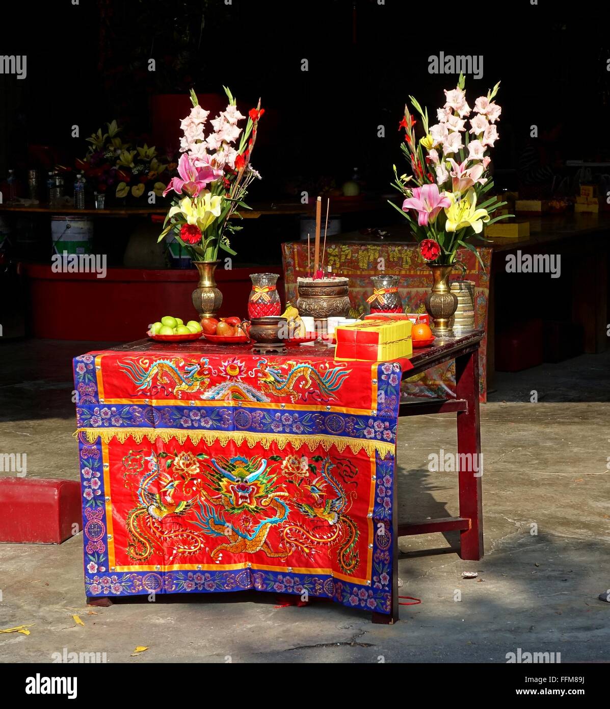 An altar with flowers, fruits, incense and ghost money in Taiwan Stock ...