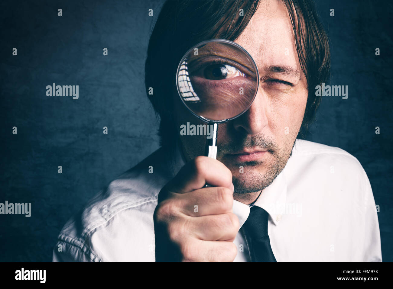 Businessman with magnifying glass, tax inspector doing financial ...