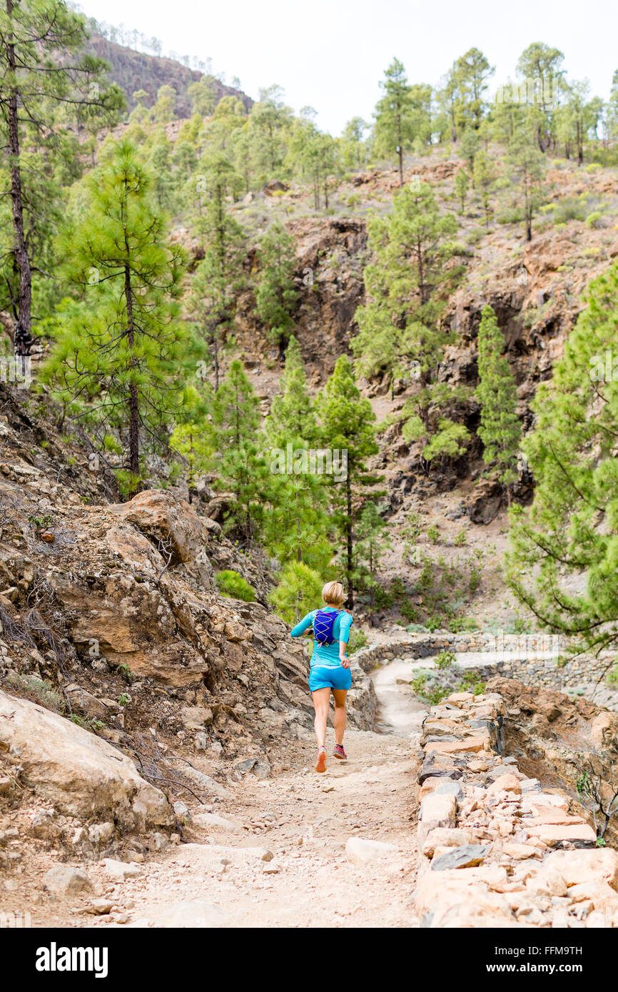 Trail runner woman cross country running in mountains, inspirational ...