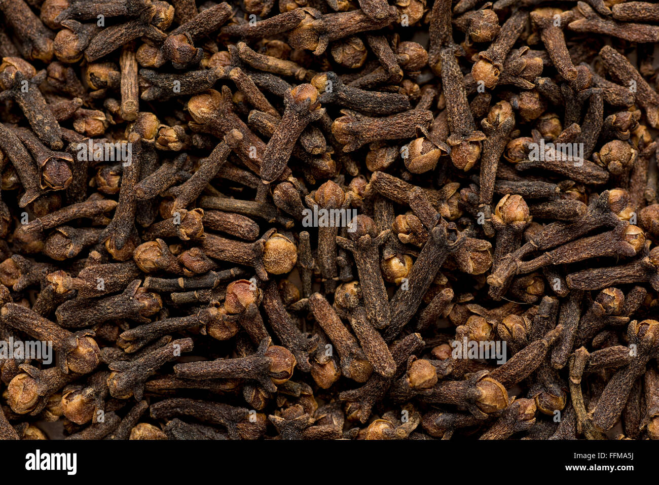 freshly dryed clove spice texture close up Stock Photo - Alamy