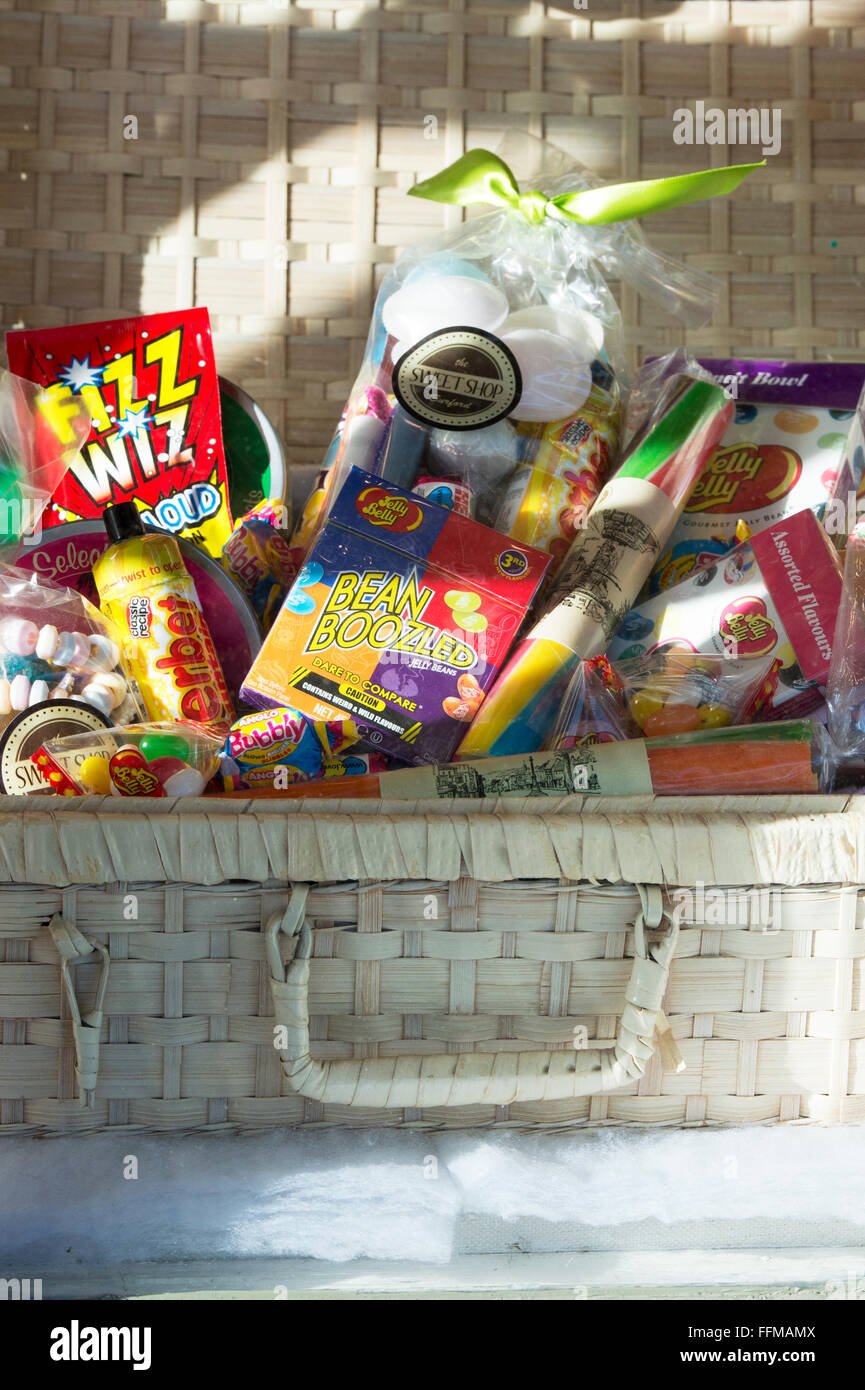 Basket of childrens sweets in a sweet shop window in Burford. Cotswolds ...