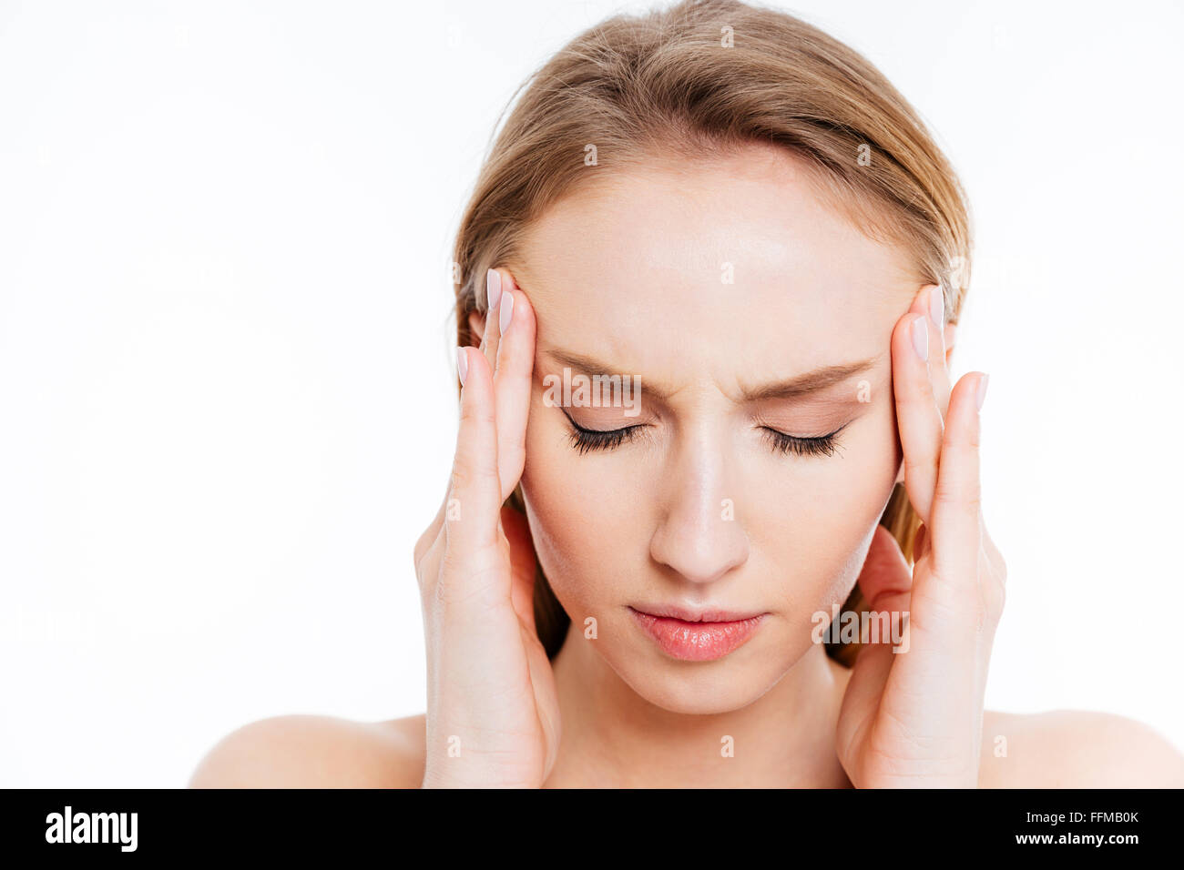 Closeup portrait of a young woman with headache isolated on a white ...