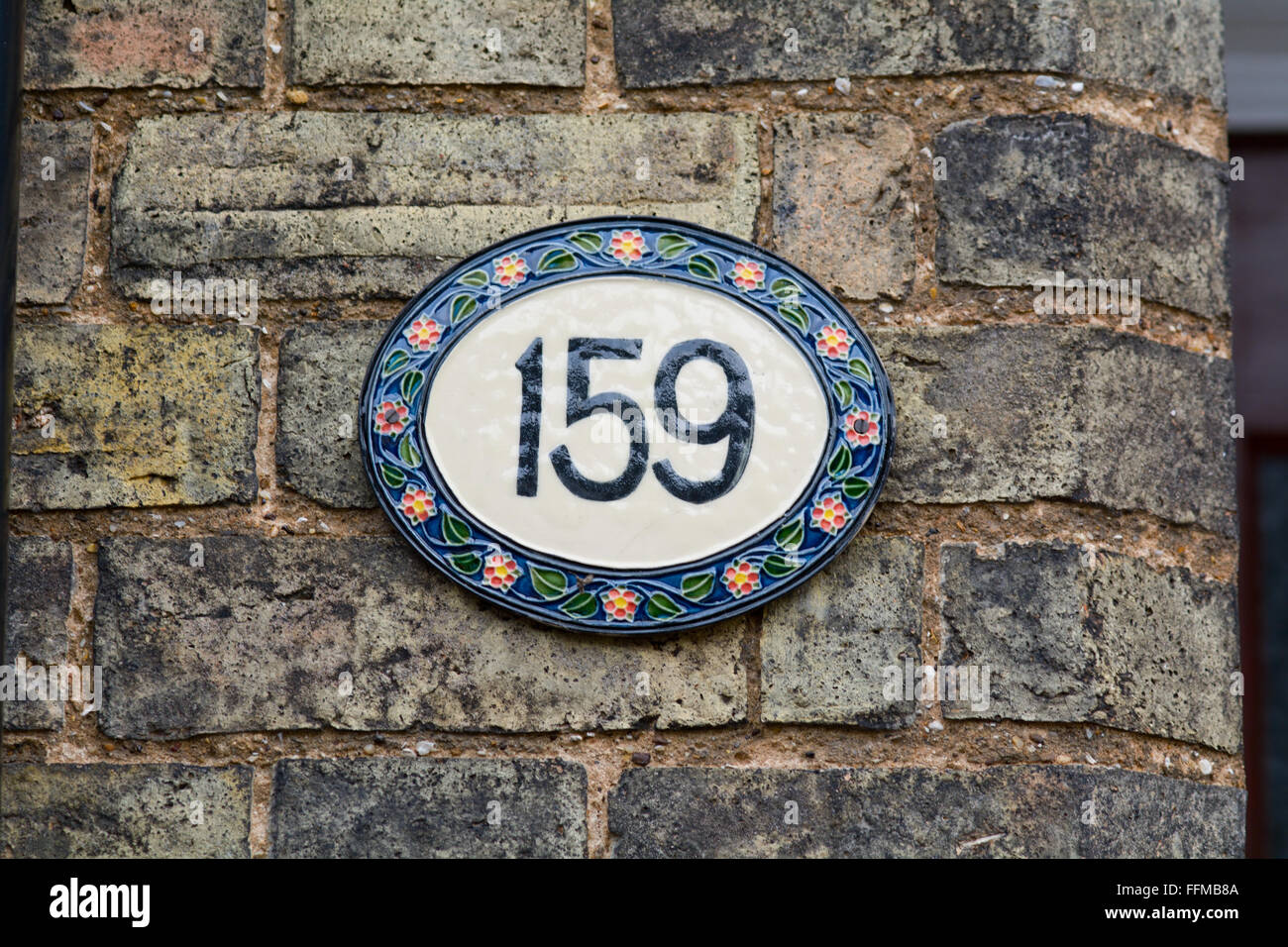 House number 159 sign on wall Stock Photo - Alamy