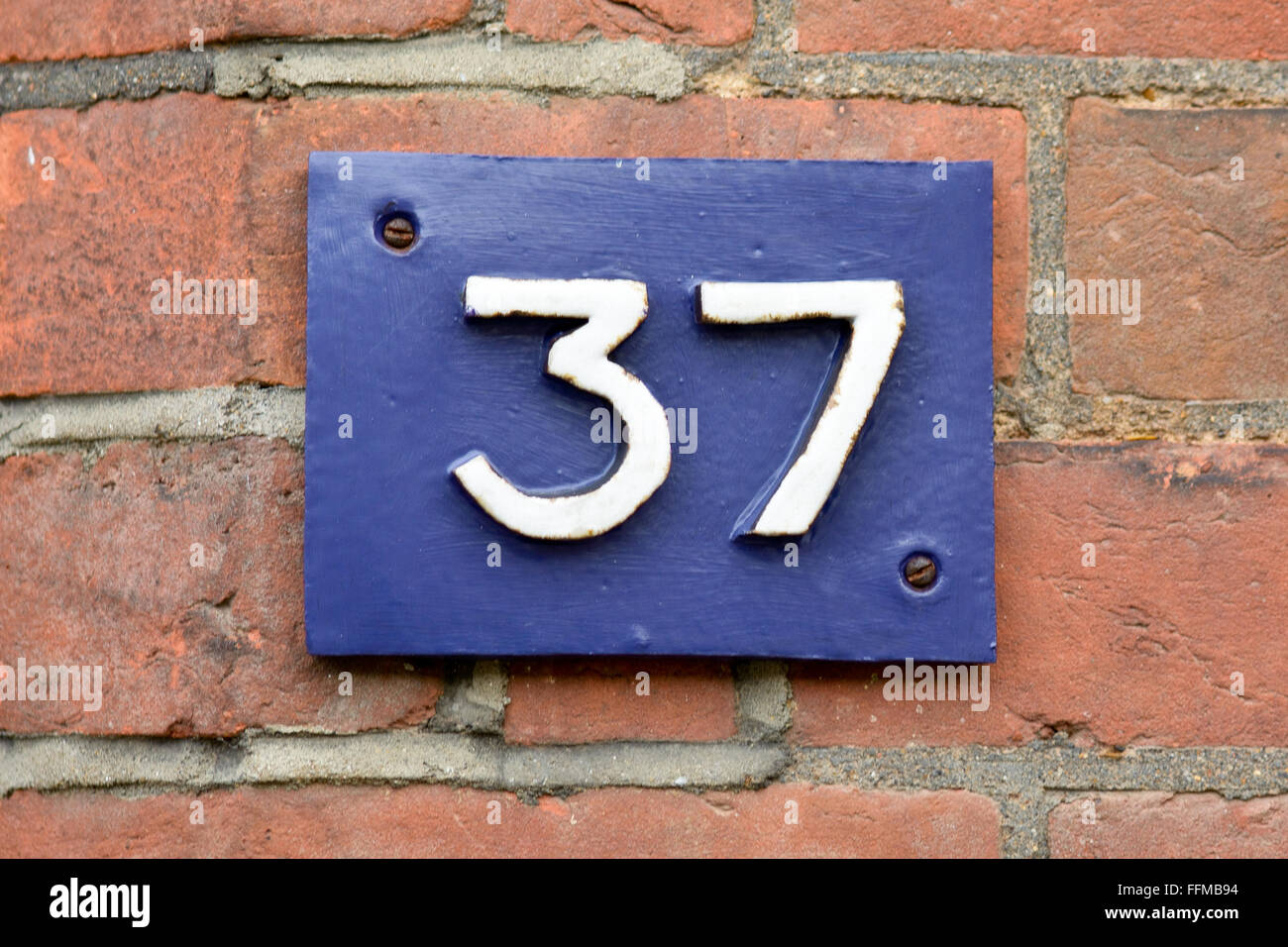 House number 37 sign on wall Stock Photo - Alamy