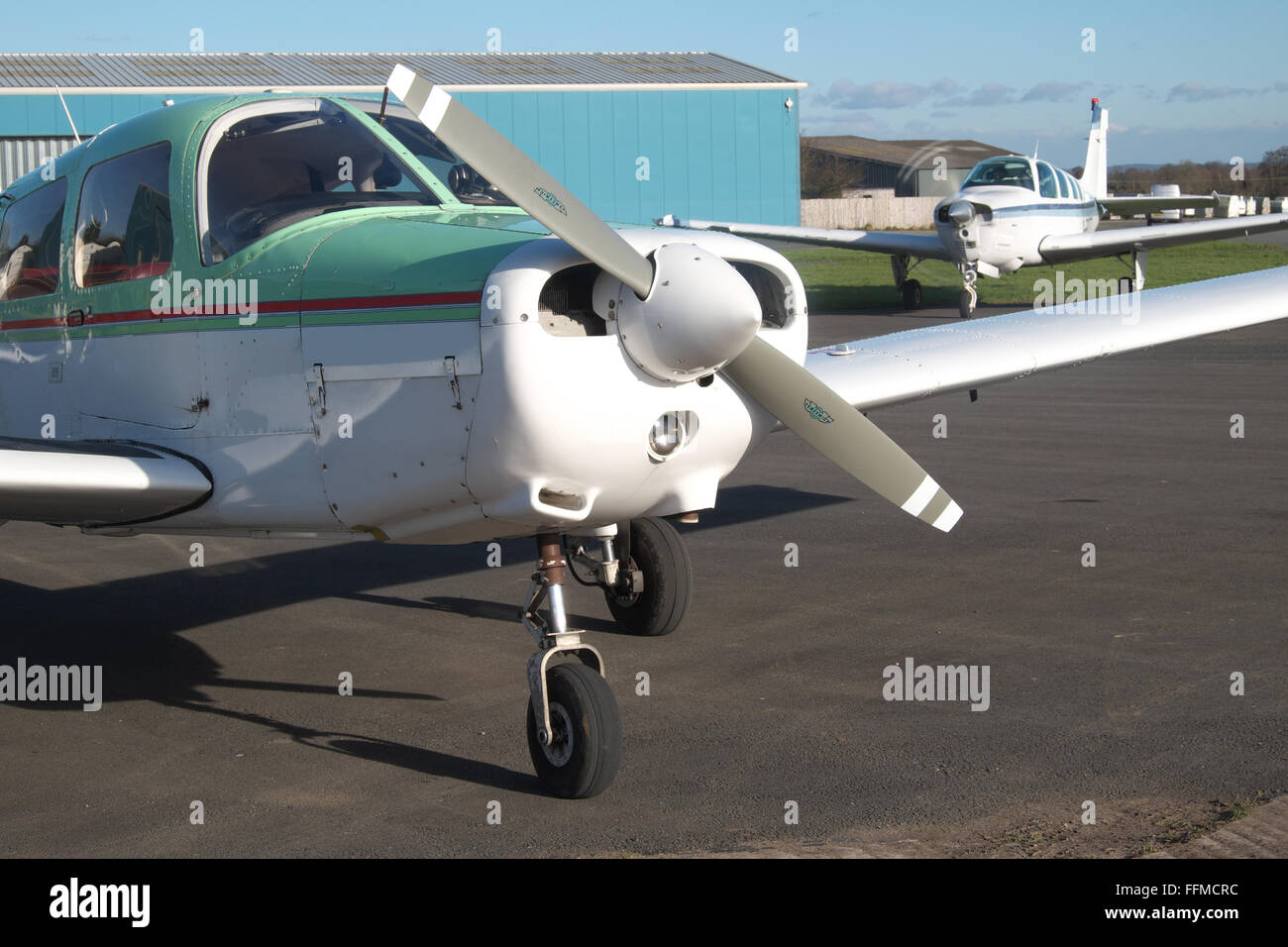 General Aviation airport flight line showing a Piper Pa-28 Cherokee ...
