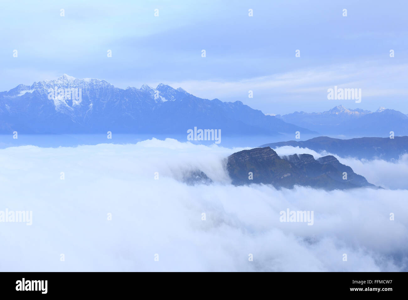 beautiful rolling clouds and frozen mountain summits landscape Stock ...