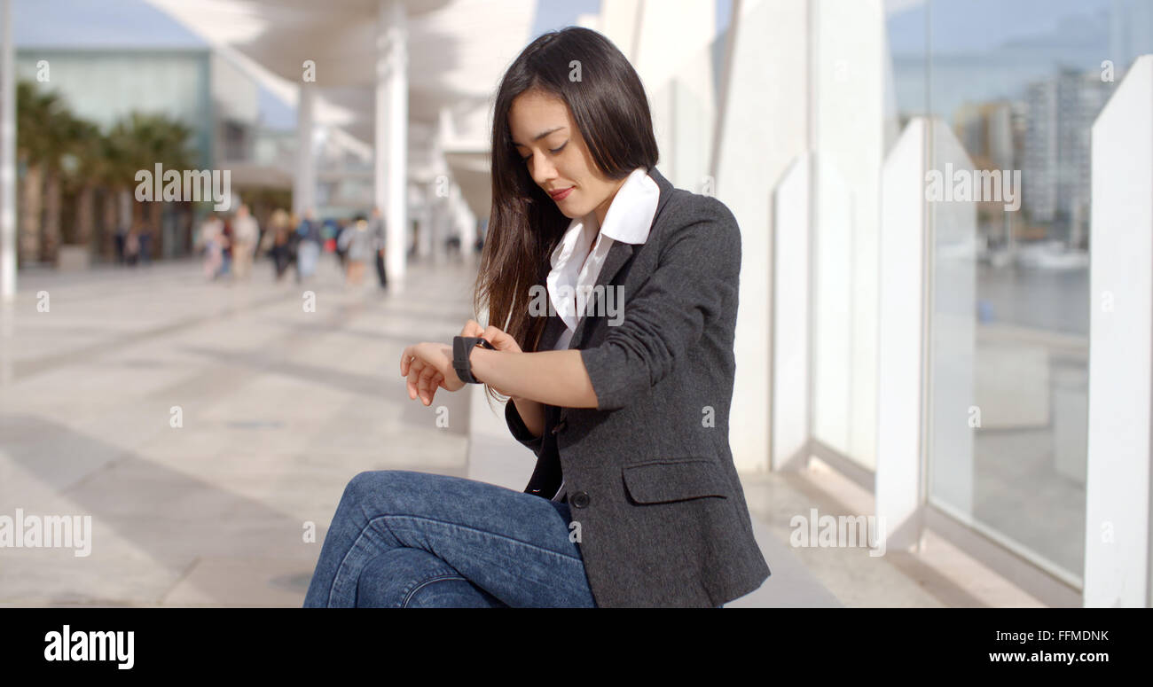 Asian woman checking watch hi-res stock photography and images - Alamy