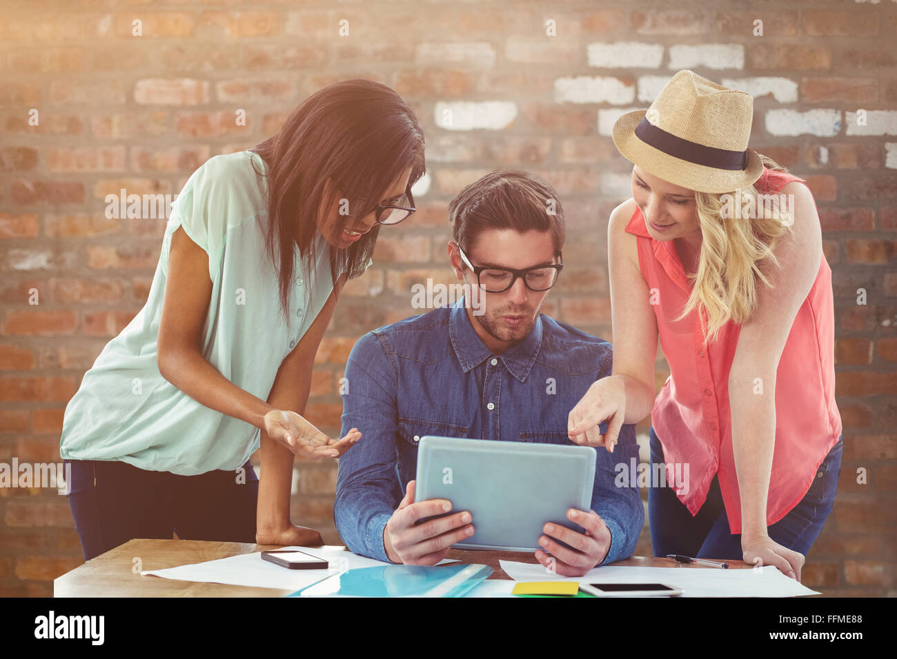 Composite image of creative business team working hard together Stock ...