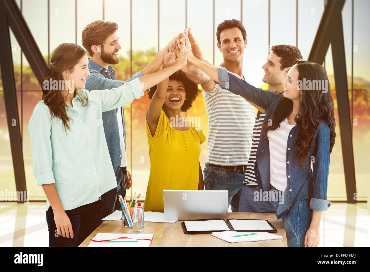 Composite image of group of young colleagues using laptop Stock Photo ...