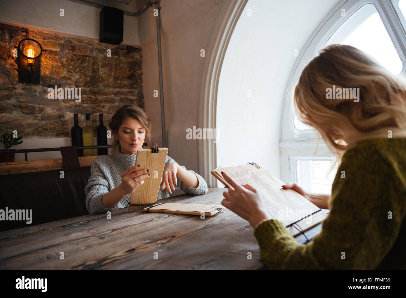 Beautiful woman reading menu hi-res stock photography and images - Alamy