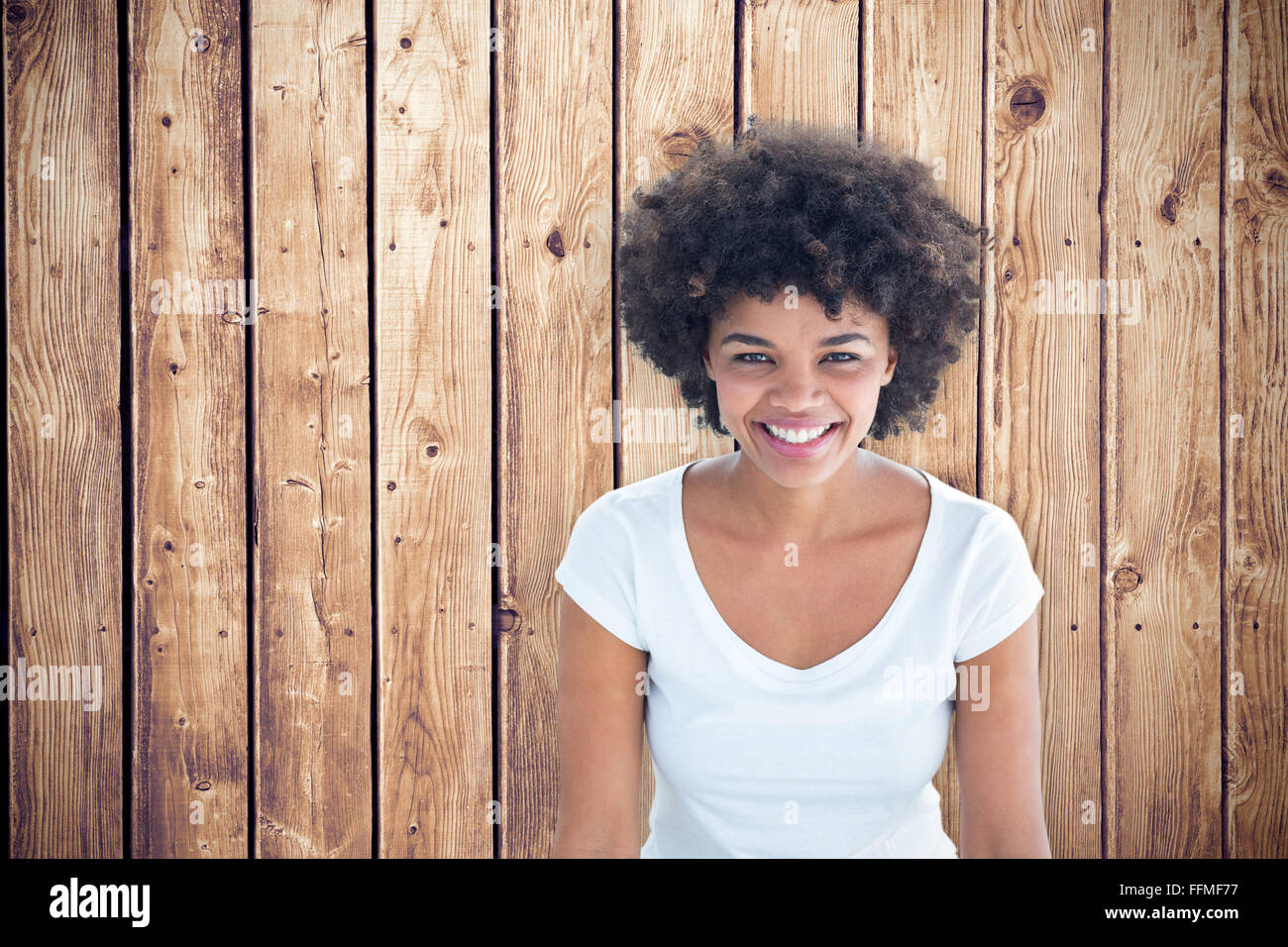 Composite image of smiling woman posing on white background Stock Photo ...