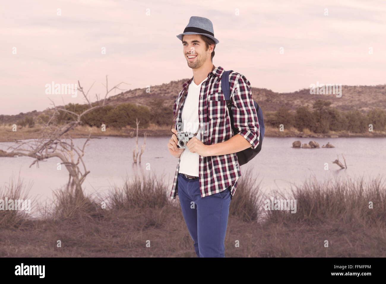 Man standing holding camera hi-res stock photography and images - Alamy